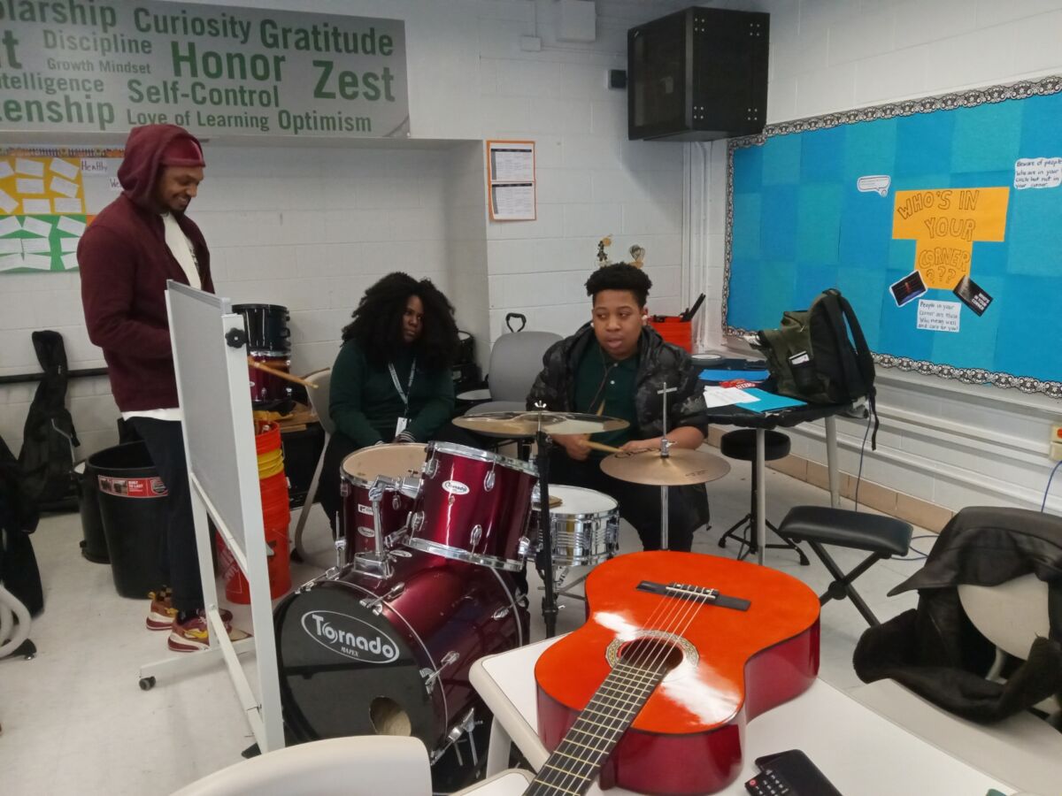 Guitars Over Guns Brings Music to Gary Comer Middle School - Noble Schools